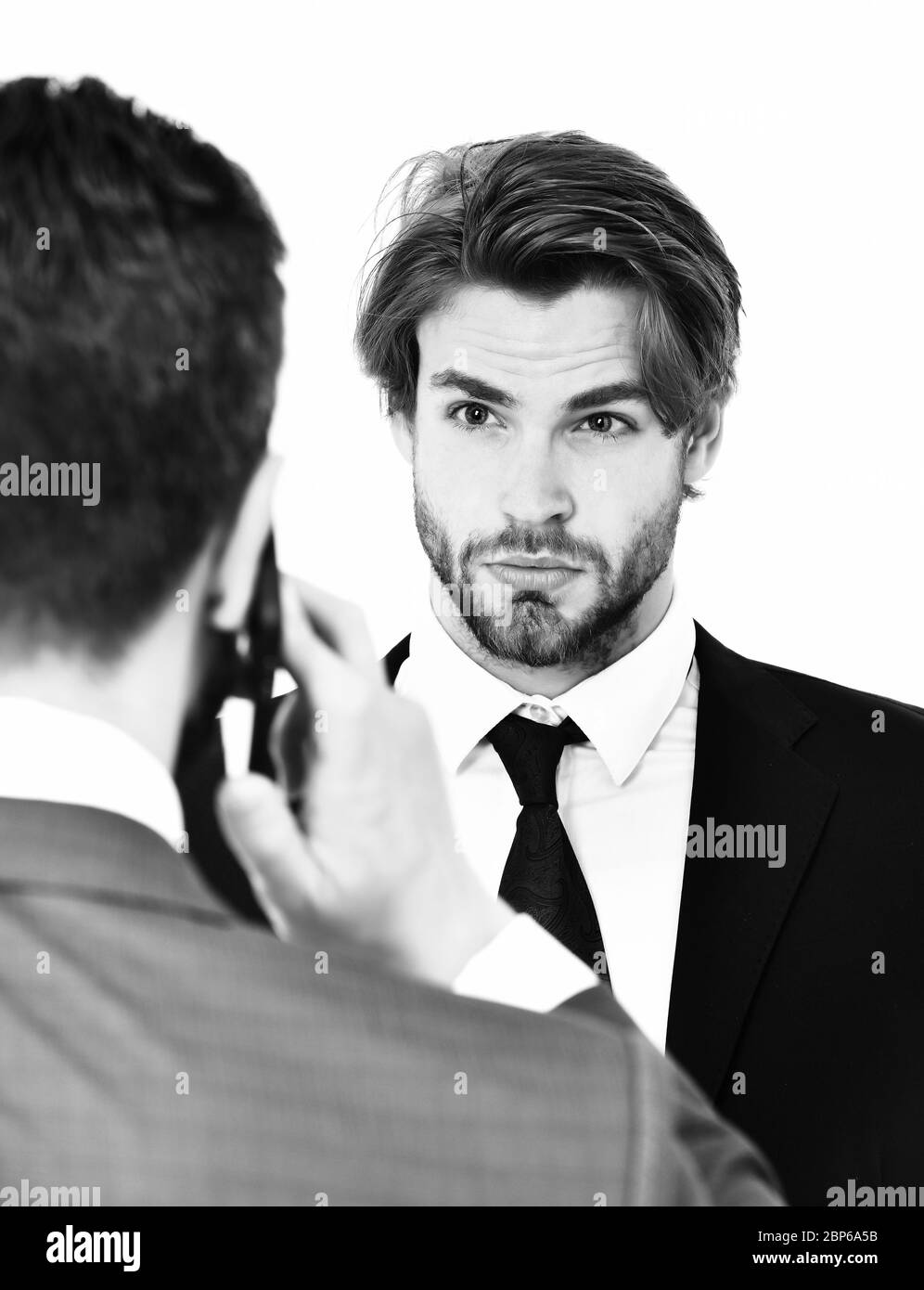 man with surprised face or businessmen speaking on mobile or cell phone ...