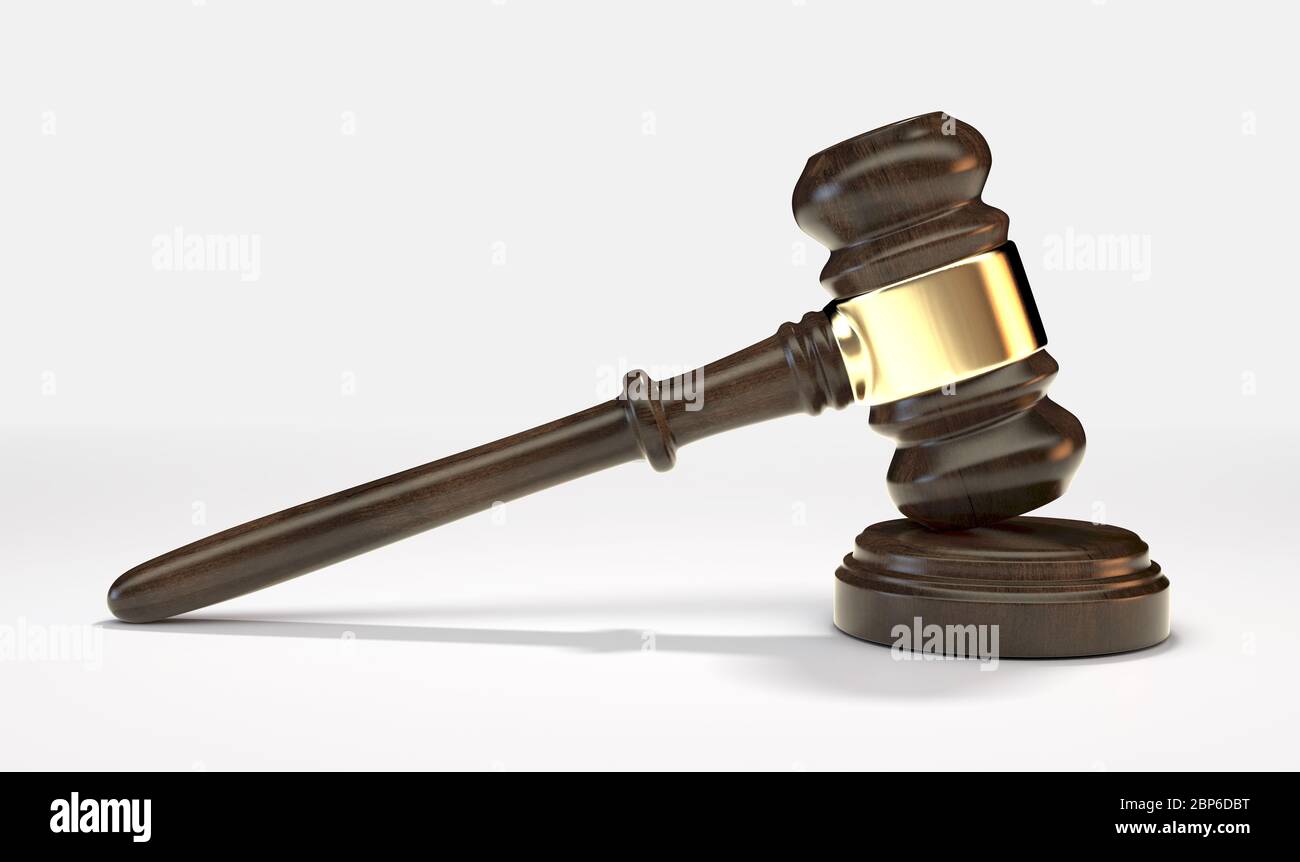 A regular wooden auctioneers hammer or judges gavel with brass trim on ...