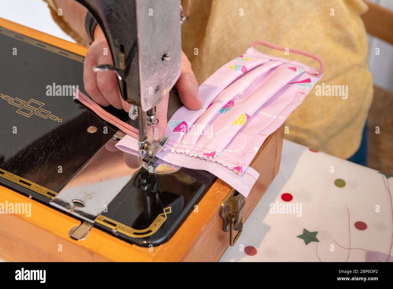 A woman makes homemade face masks during the 2020 covid 19 coronavirus ...