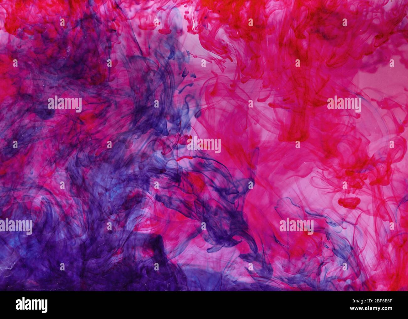 Blue red ink mixing in hi-res stock photography and images - Alamy