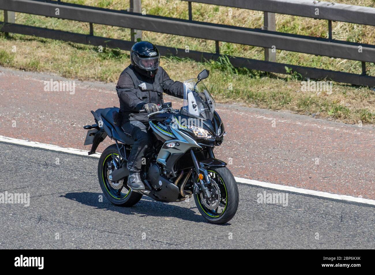 Kawasaki Versys 650; Motorbike rider; two wheeled transport ...