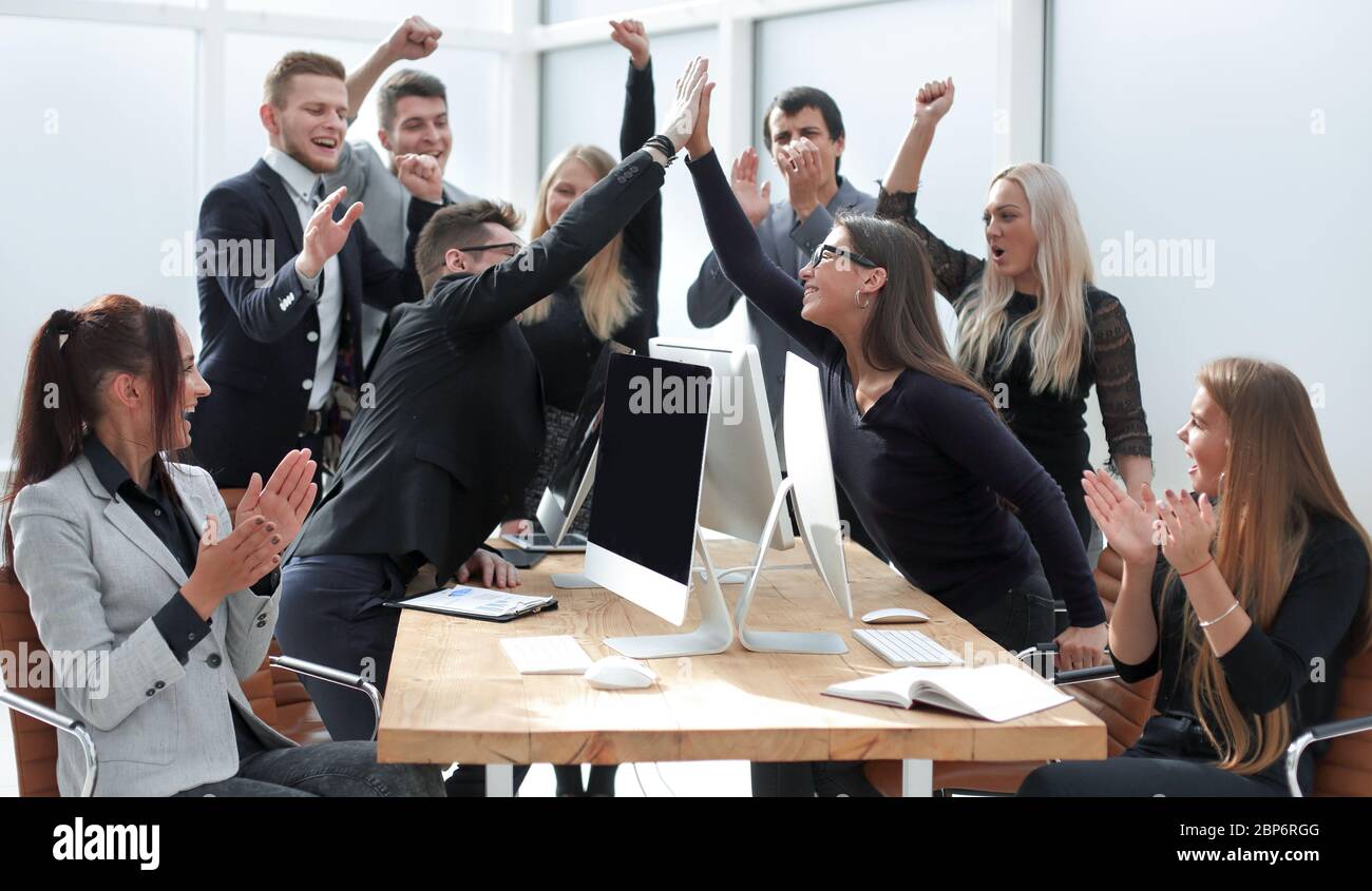 happy business team showing their success in the workplace Stock Photo ...