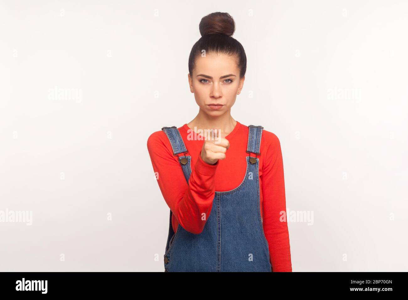 Hey you! Portrait of bossy dissatisfied angry girl with hair bun in ...