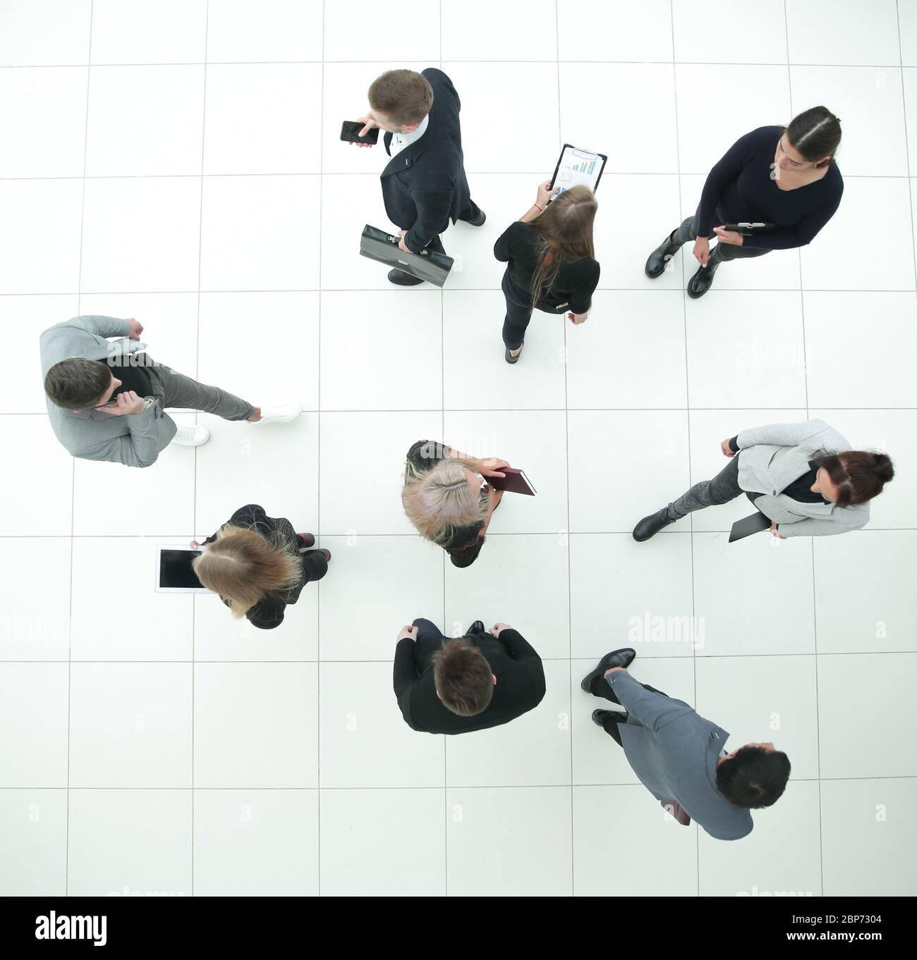top view. group of serious diverse business people looking at the ...
