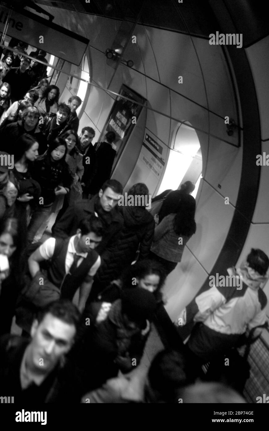 Crowded london underground platform Black and White Stock Photos ...