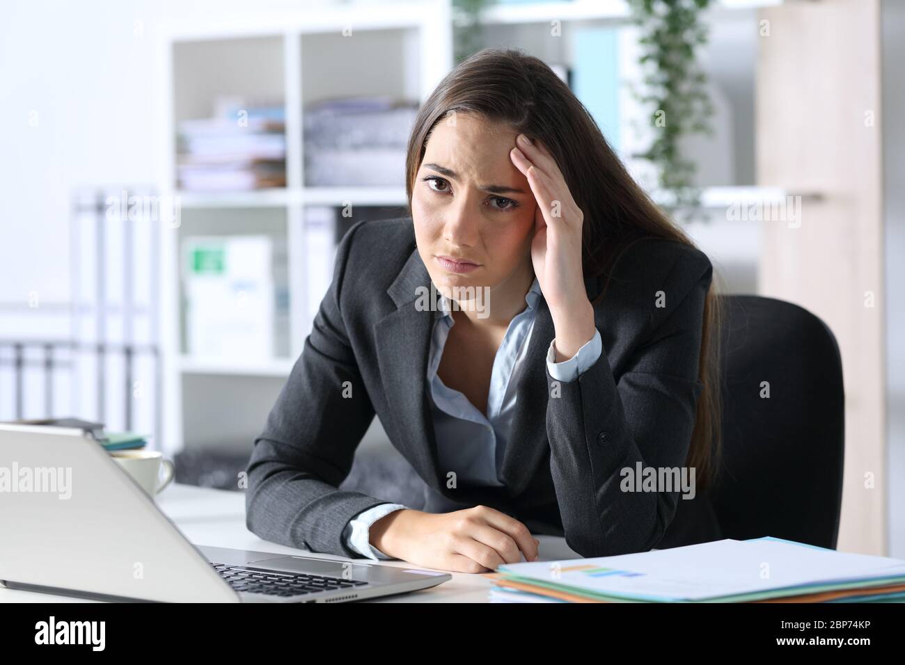 Sad entrepreneur sitting office desk hi-res stock photography and ...