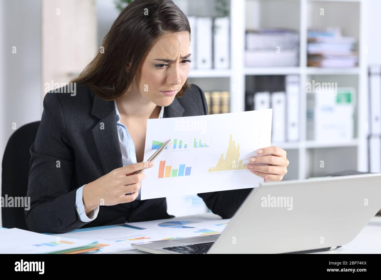 Sad executive woman showing bad results graph report on videocall on ...