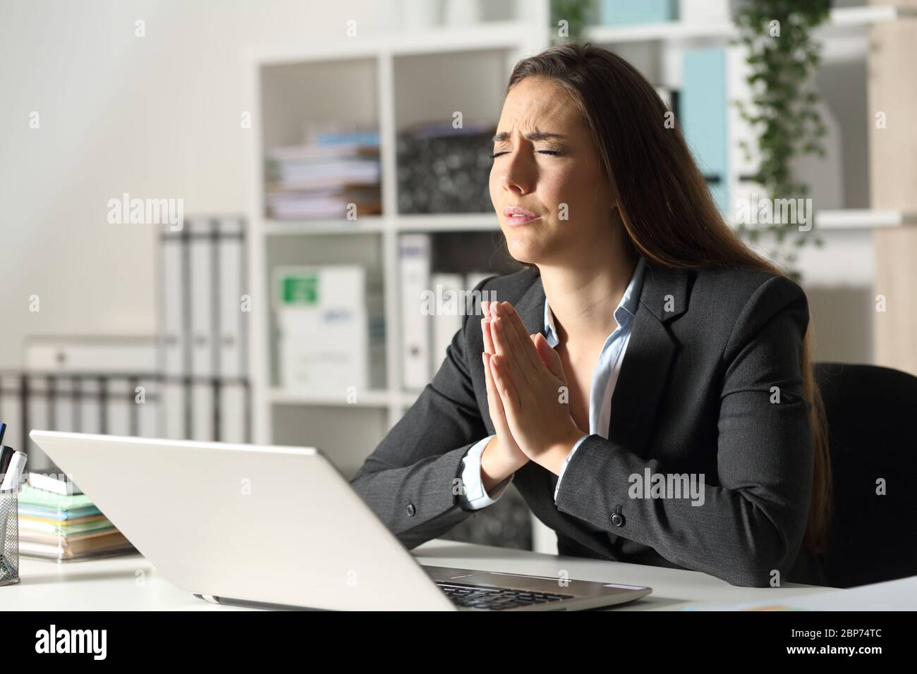 Praying At Desk High Resolution Stock Photography and Images - Alamy