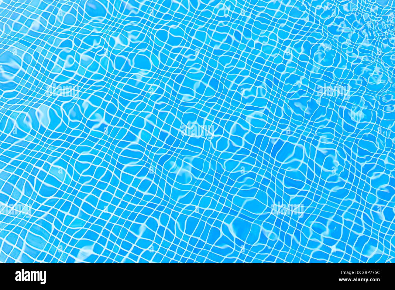 Blue floor mosaic tiles of swimming pool, water surface with ripple ...