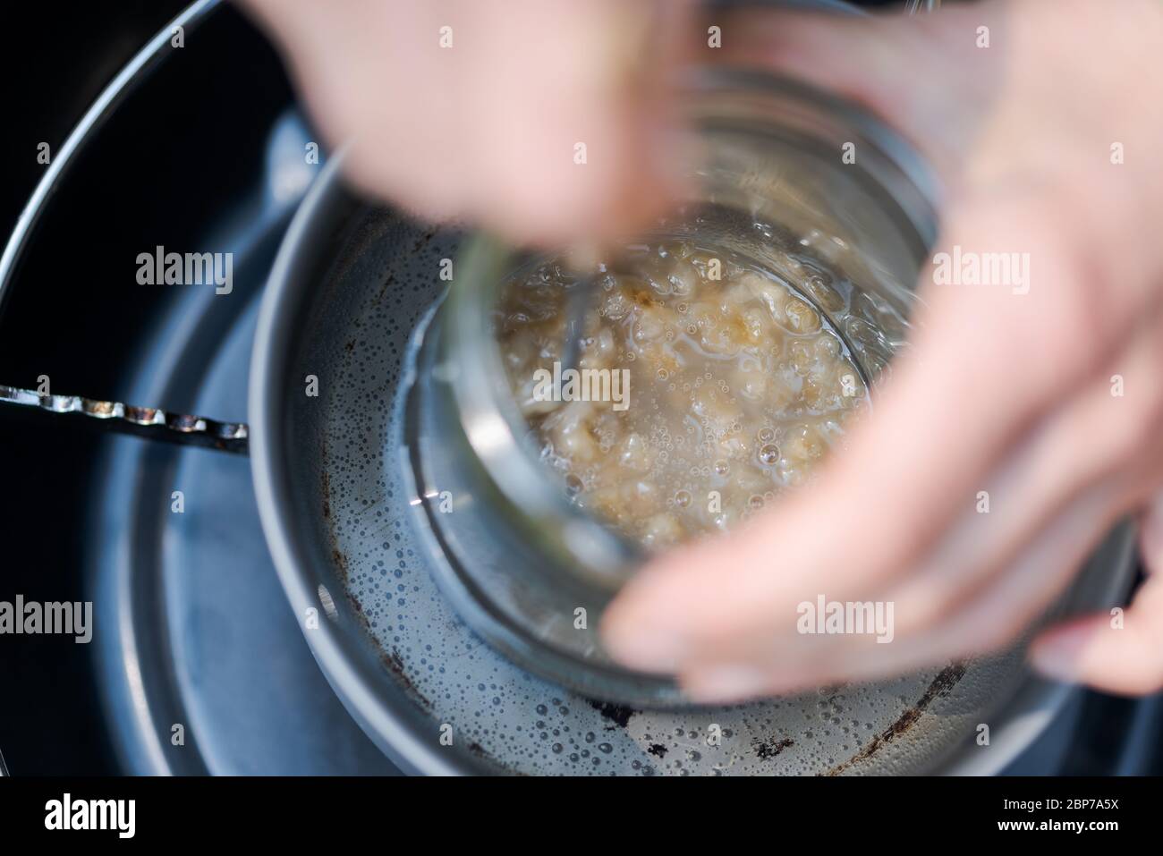 Top view of human hand stirring in glas with bone glue Stock Photo - Alamy