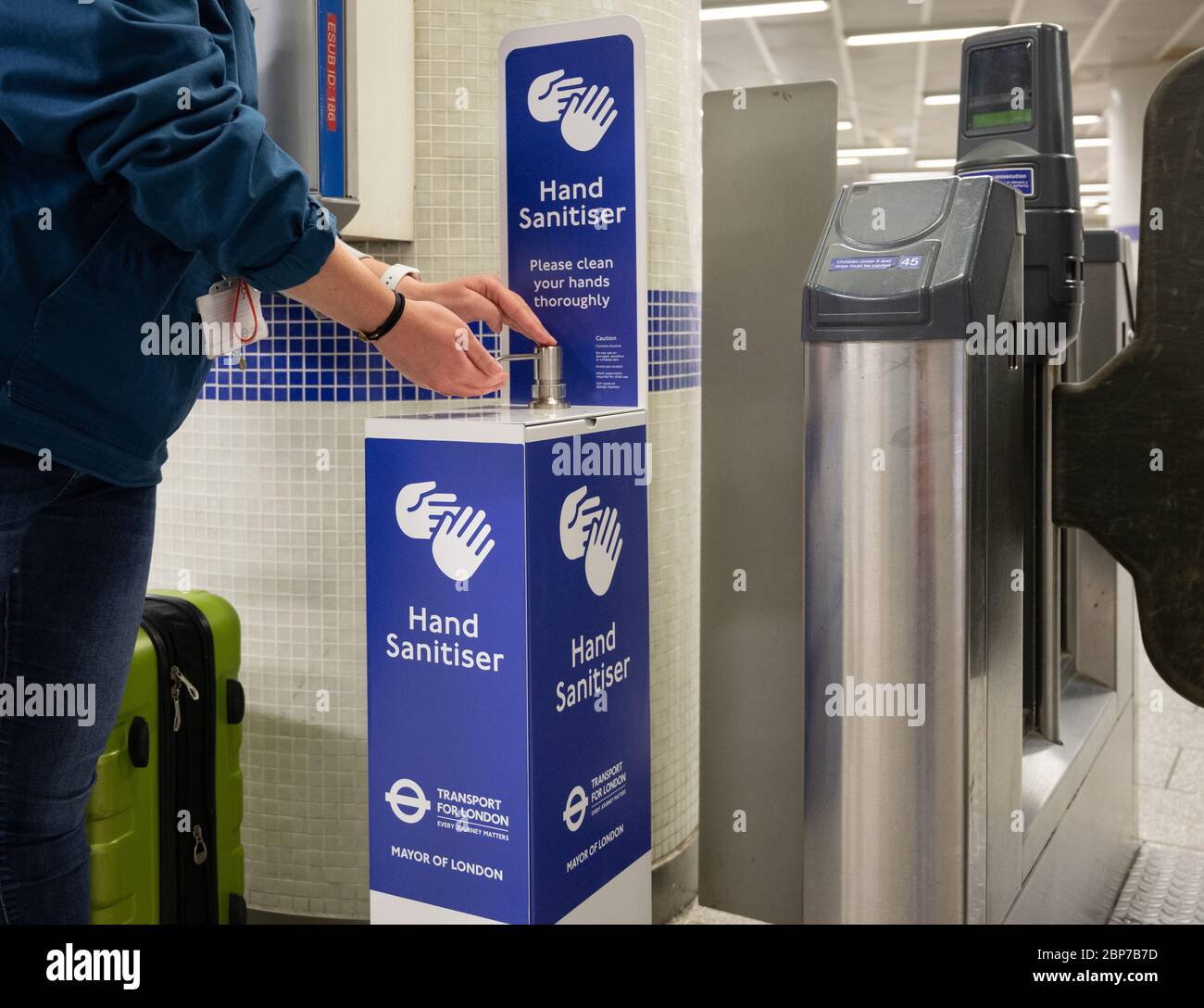 Passengers use hand sanitiser points on the London Underground during ...