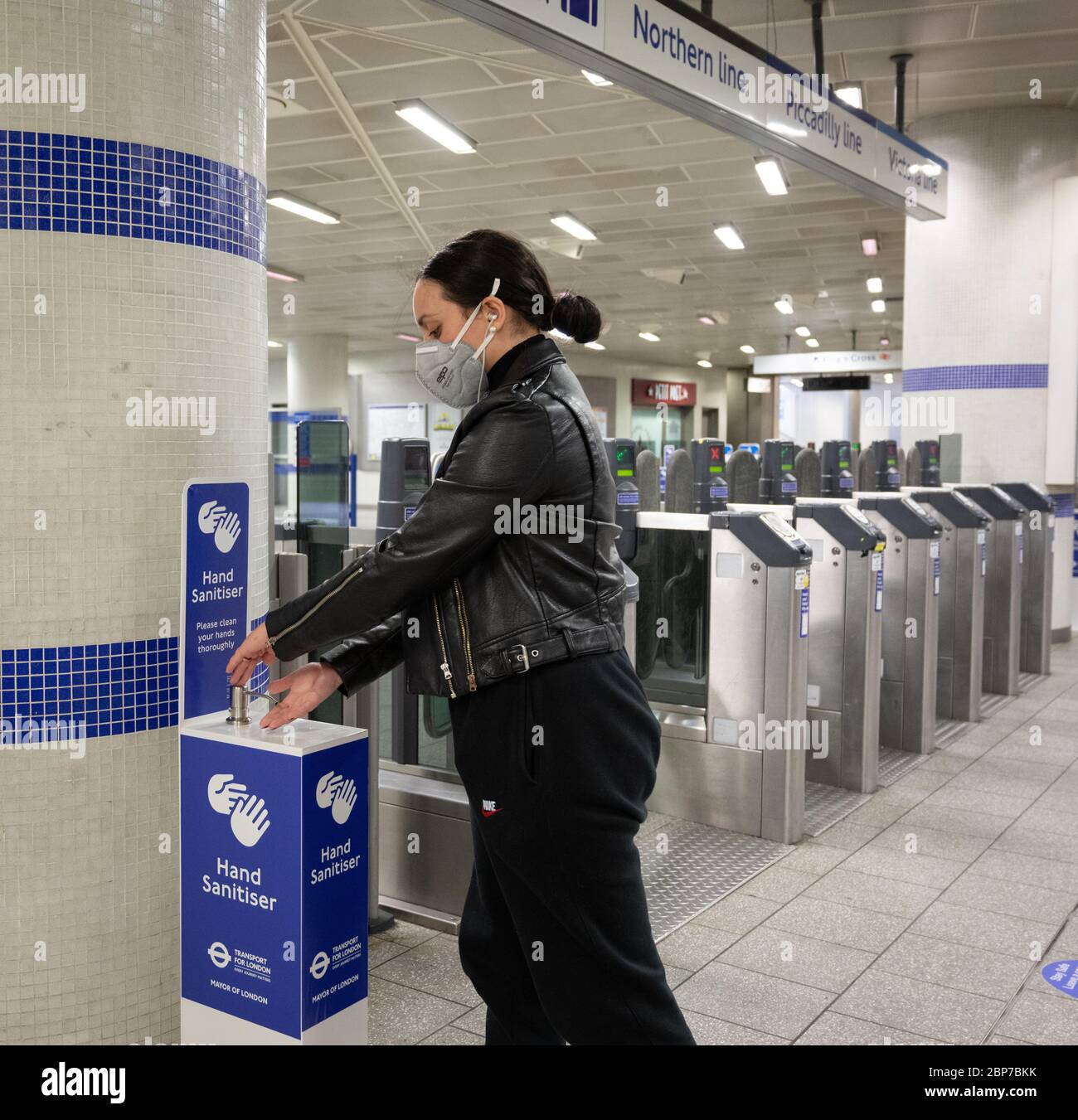 Passengers use hand sanitiser points on the London Underground during ...