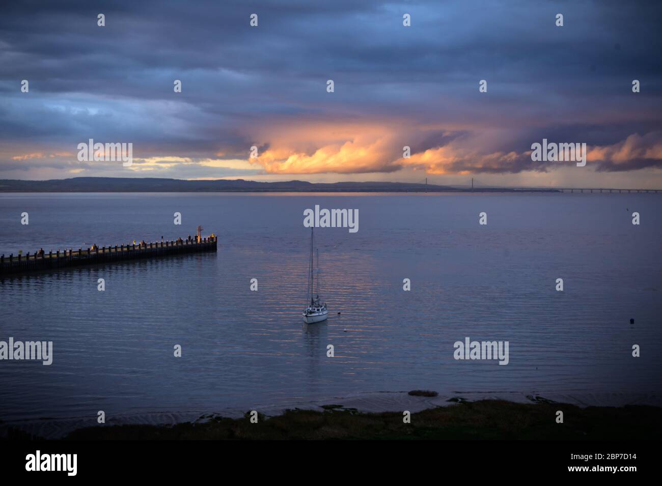 Landscape across an estuary jetty Stock Photo - Alamy