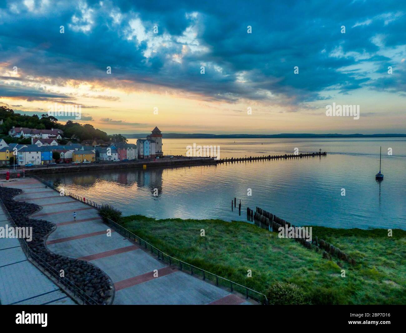 Landscape across an estuary jetty Stock Photo - Alamy