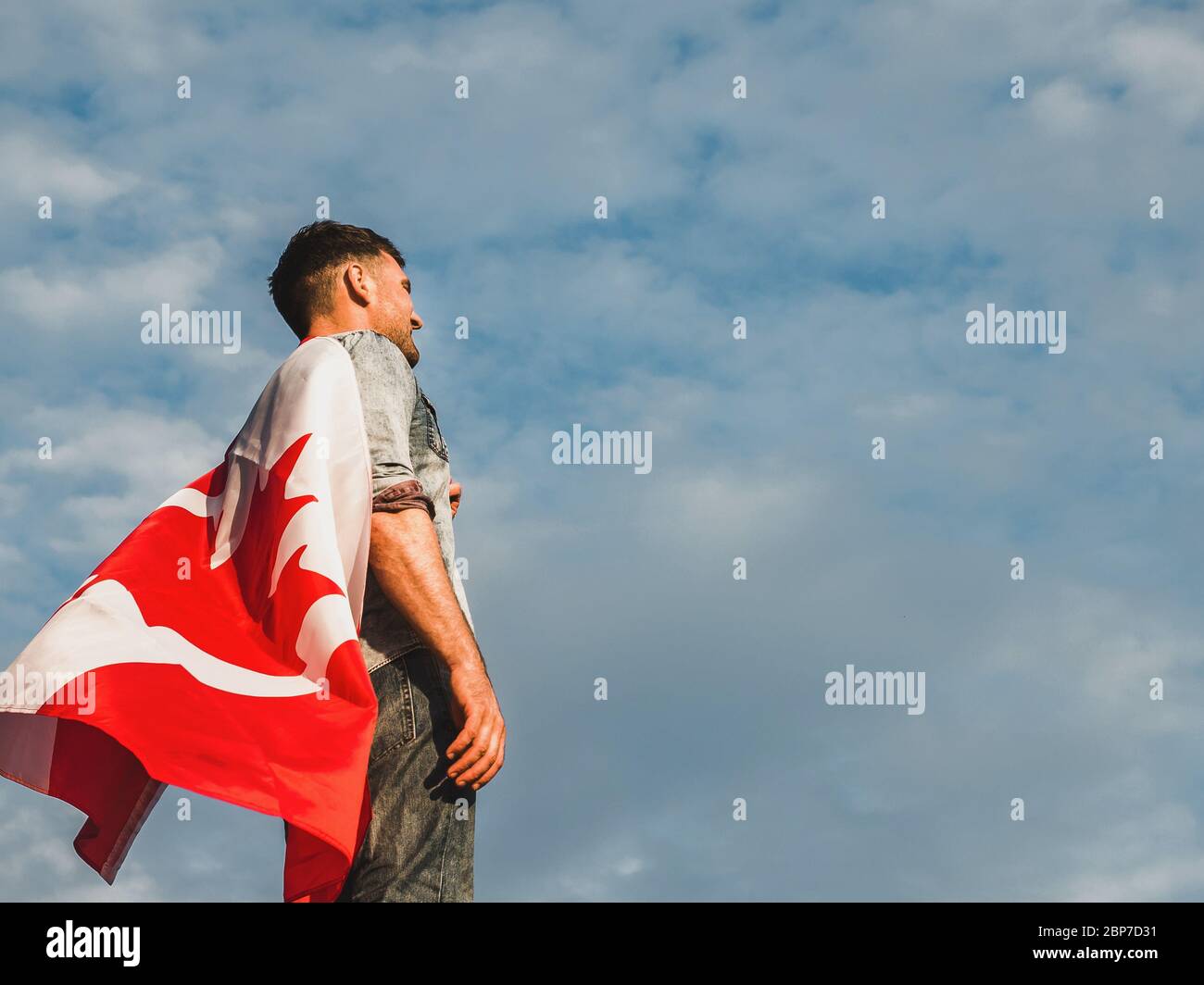 Attractive man holding Canadian Flag. National holiday Stock Photo - Alamy