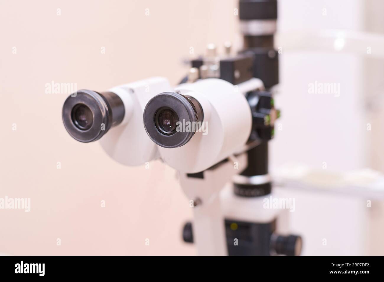 ophthalmologist doctor in exam optician laboratory with female patient ...