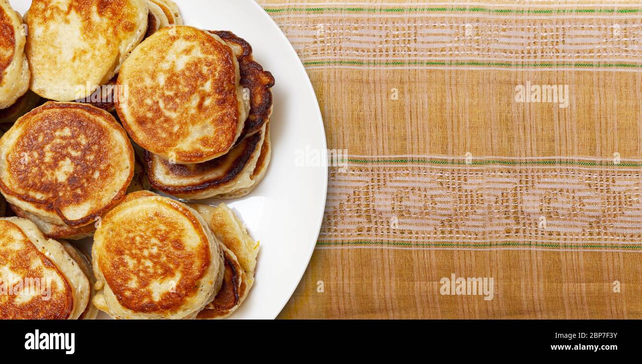 CHISINAU, MOLDOVA - May 18, 2020: Pile of freshly baked pancakes lay on ...