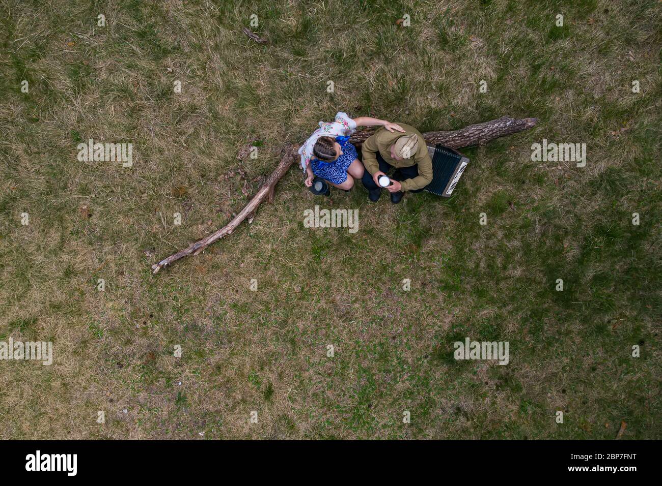 girl with a soldier sitting on the ground top view Stock Photo - Alamy