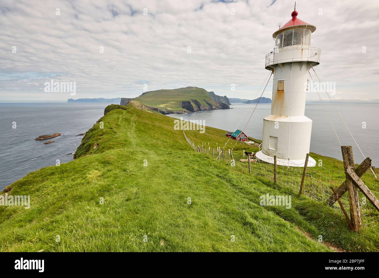 Mykines lighthouse and cliffs on Faroe islands. Hiking landmark ...