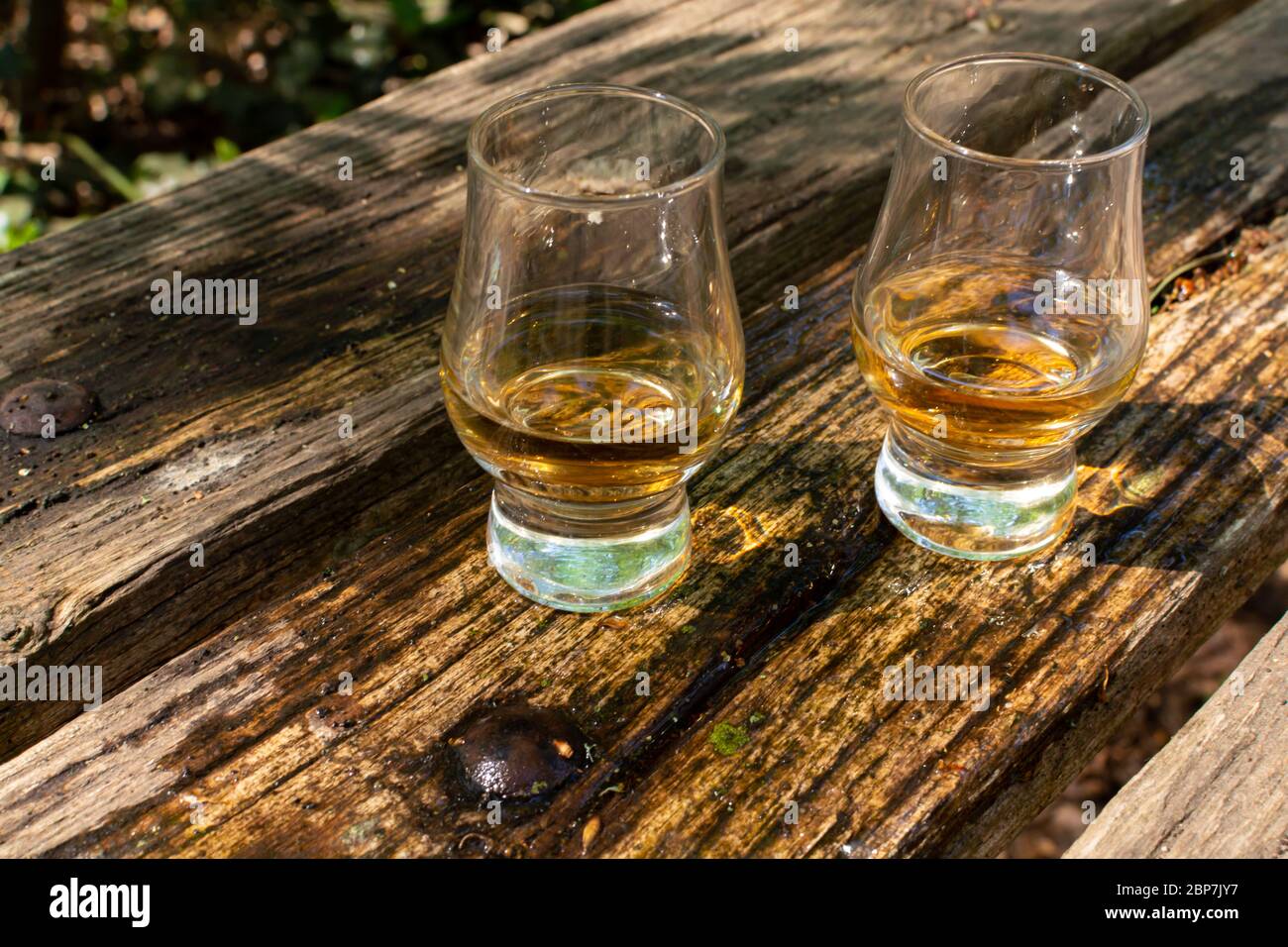 Tasting of different Scotch whiskies on outdoor terrace, dram of ...