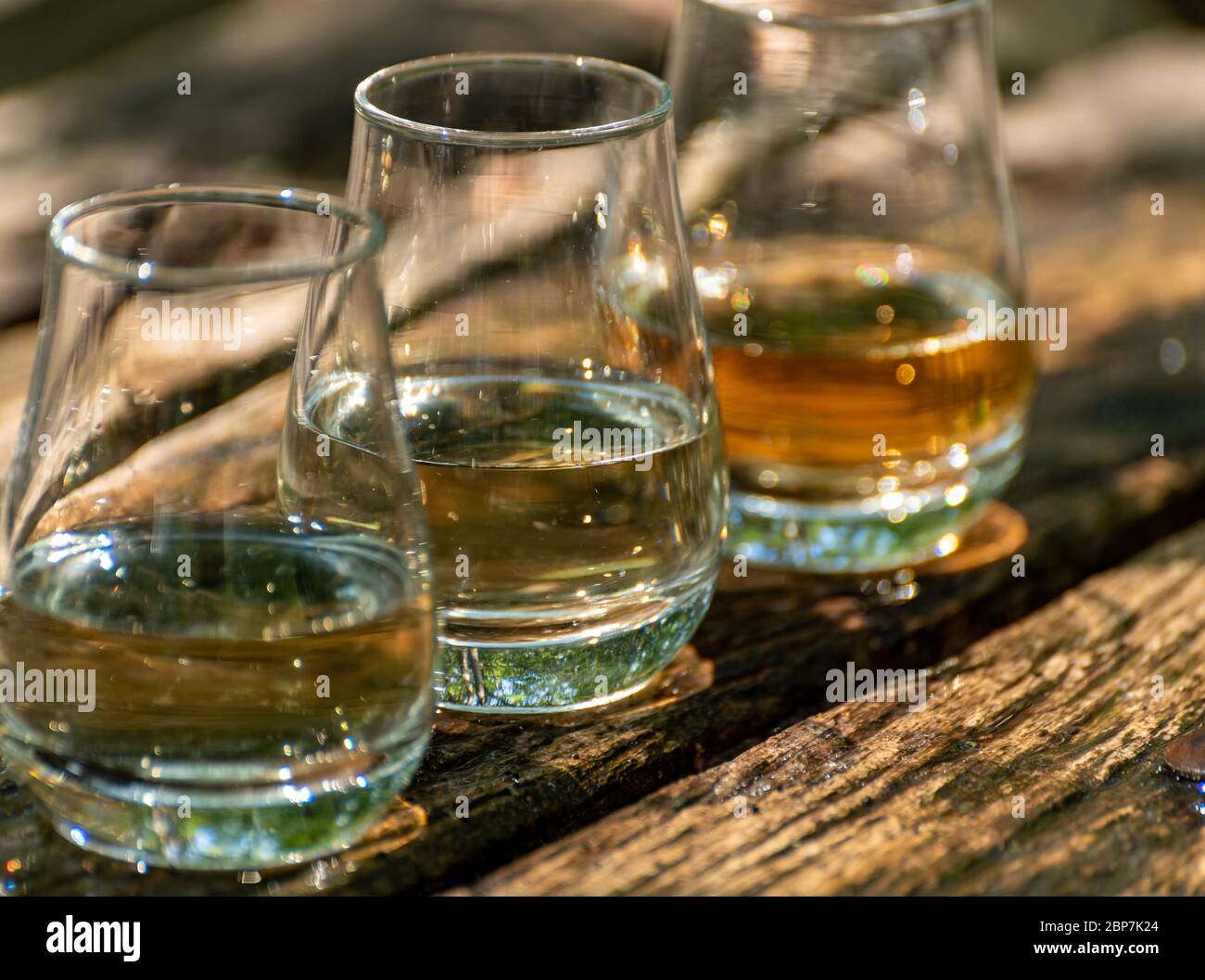 Tasting of different Scotch whiskies on outdoor terrace, dram of ...