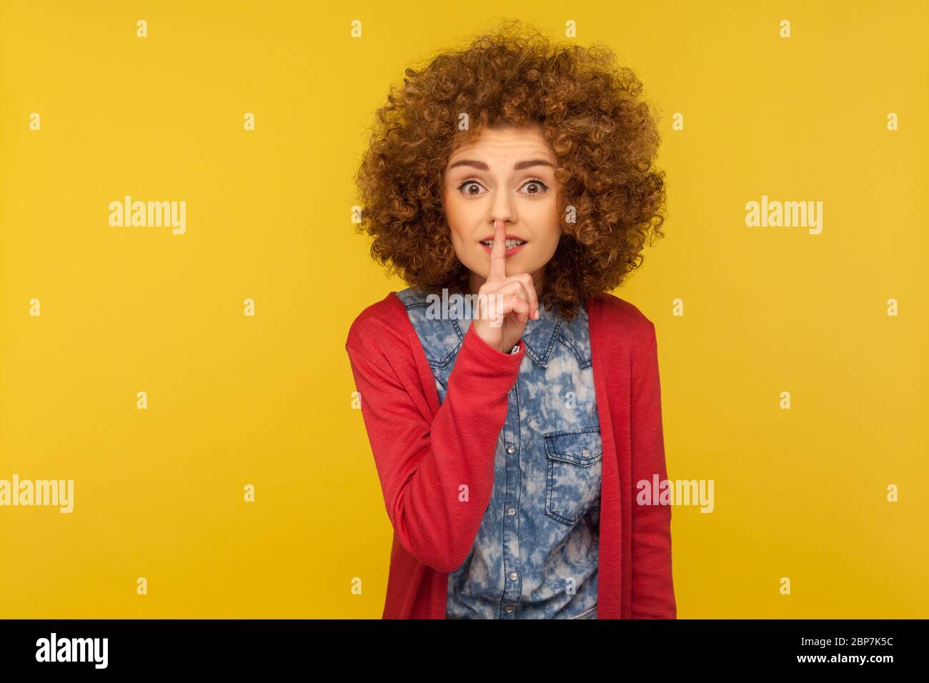 Woman shushing smile hi-res stock photography and images - Alamy