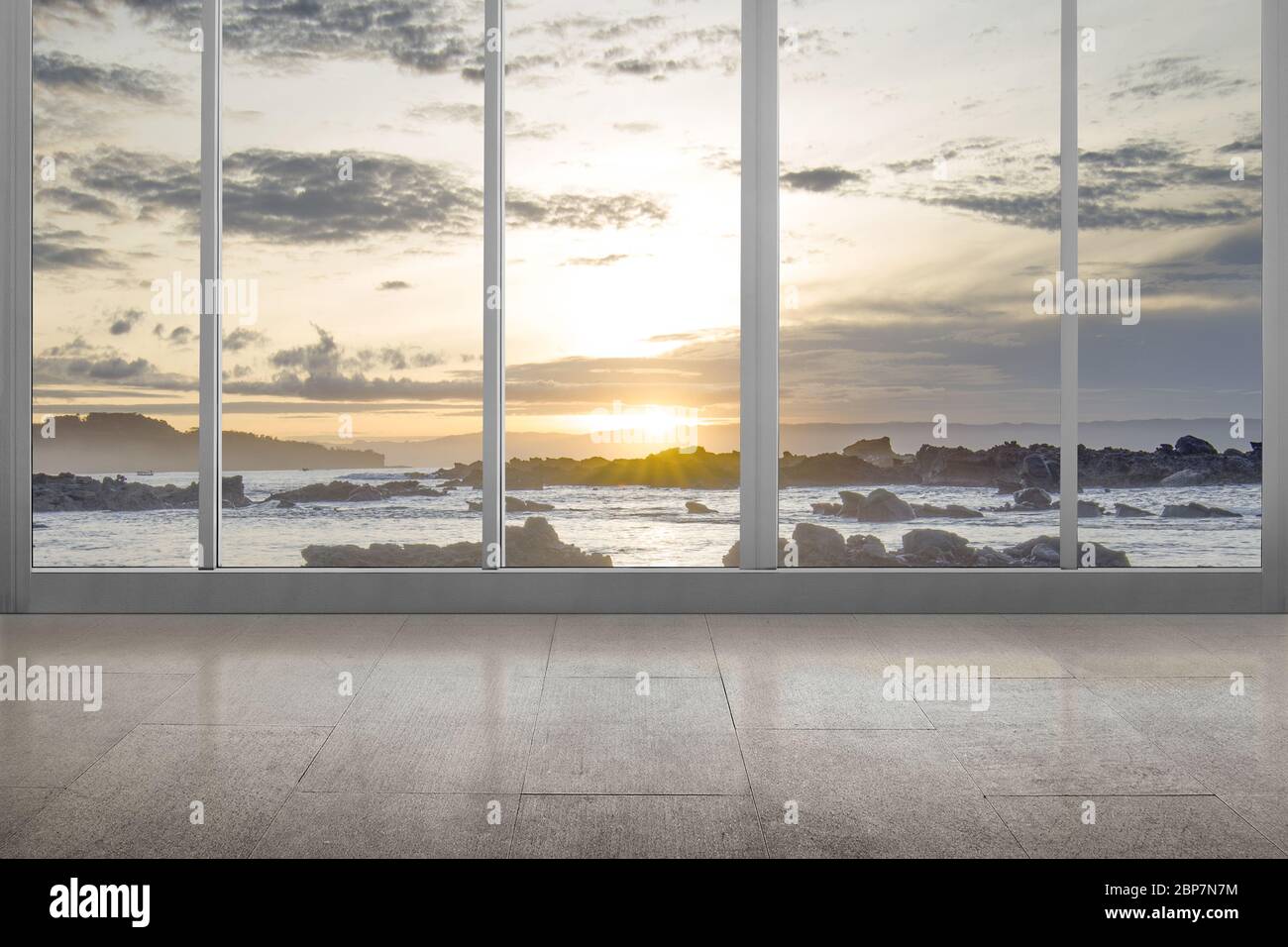 Empty room with ocean view and rocks over sunset sky background Stock ...