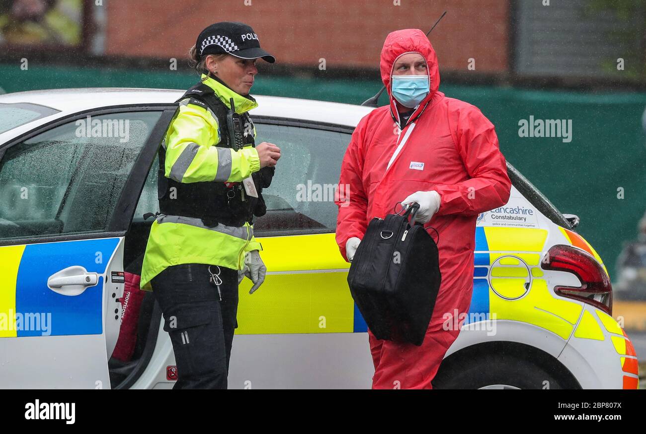 Police at the scene on King Street, Blackburn, following the death of a ...