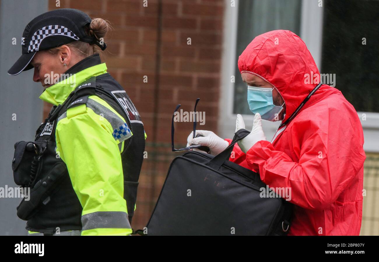 Police at the scene on King Street, Blackburn, following the death of a ...
