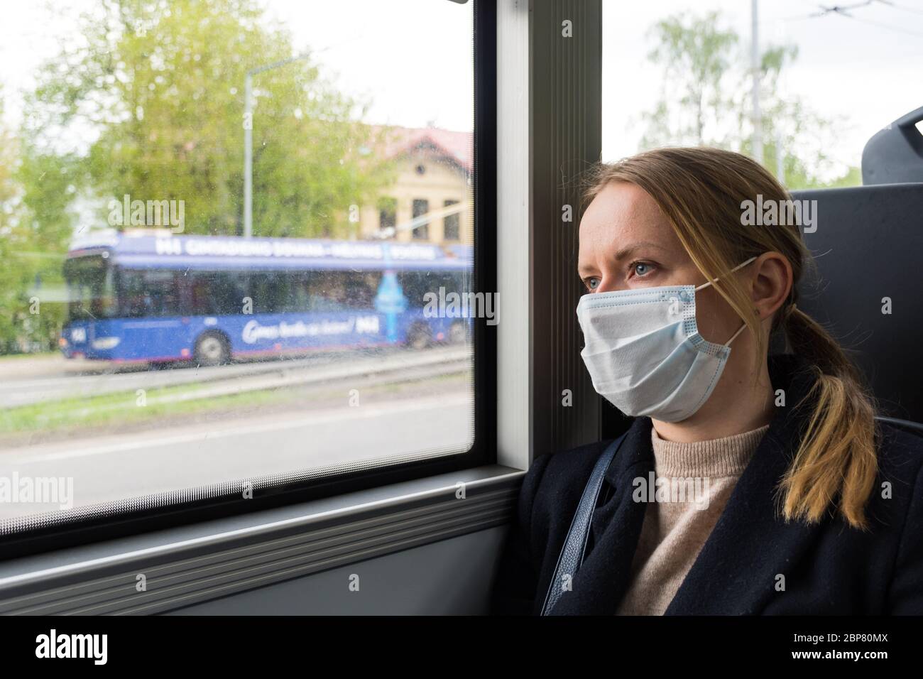 Girl sitting tram stop hi-res stock photography and images - Alamy