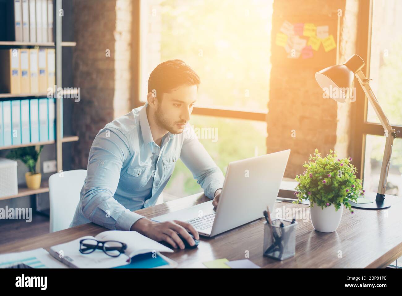 Ponder young middle eastern handsome banker man. He is wearing the ...