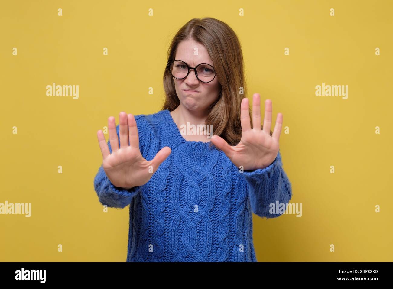 Woman pushing away hands hi-res stock photography and images - Alamy