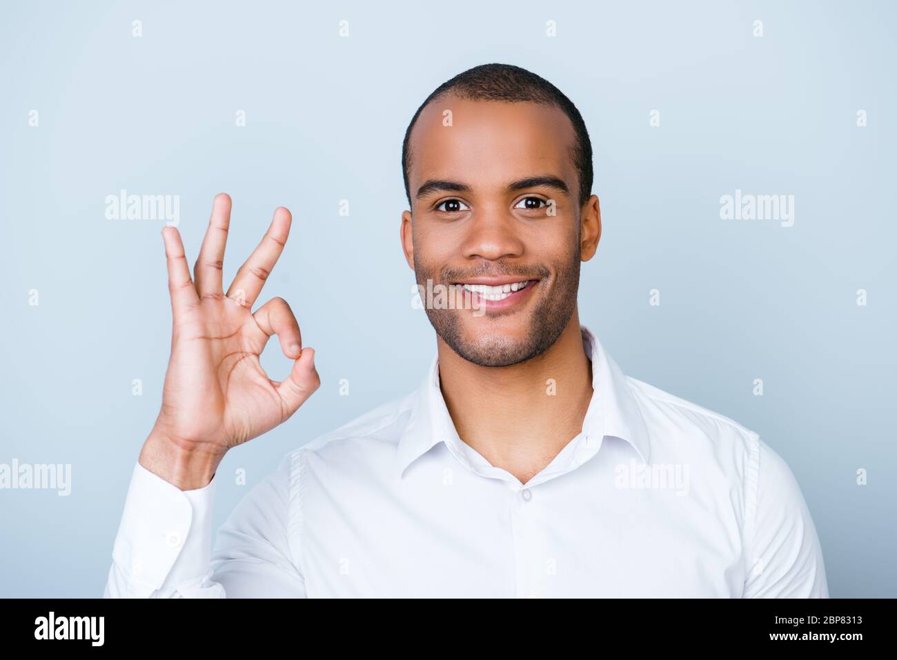 Successful excited young mulatto african man banker with bristle in ...