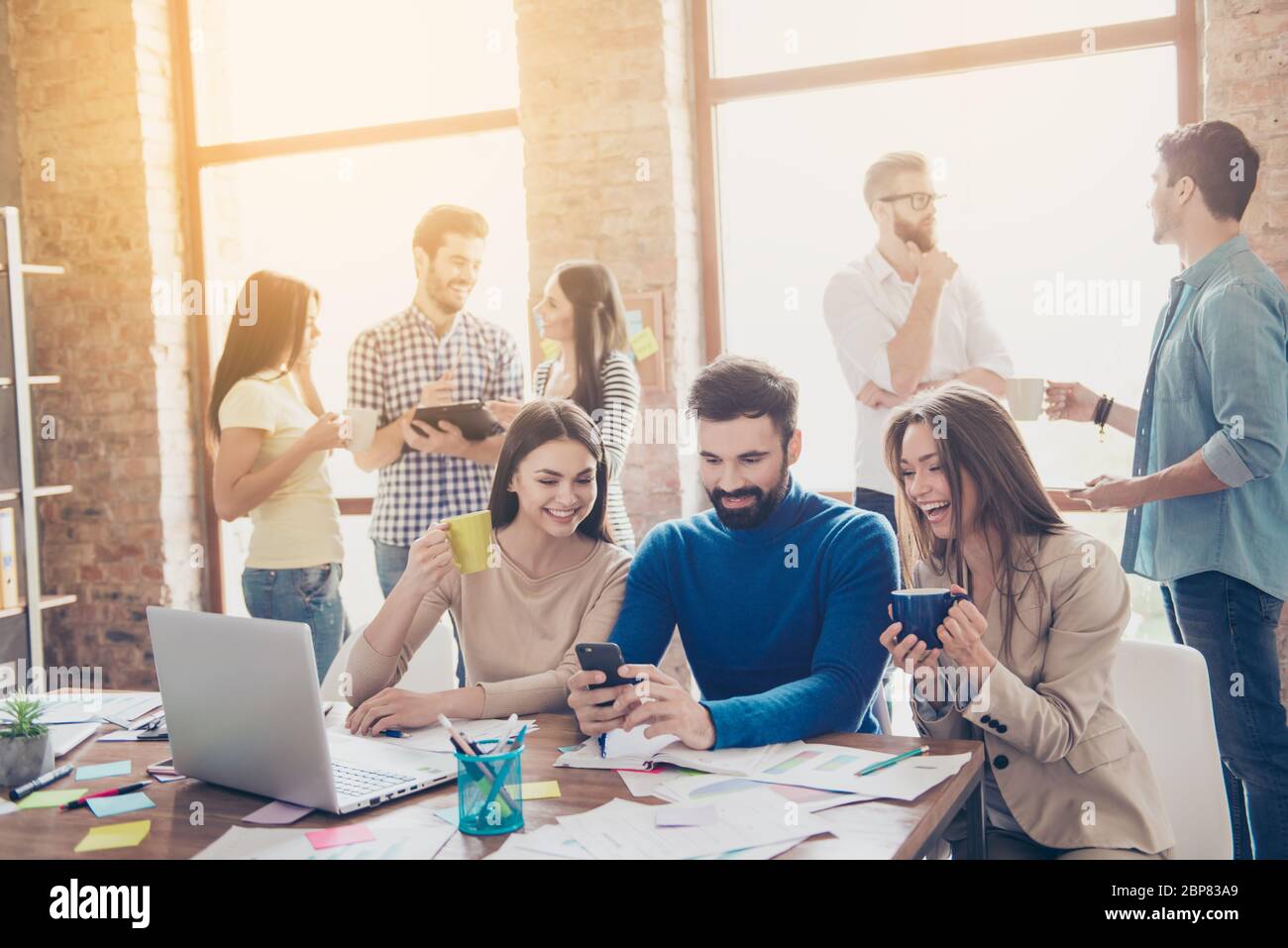 Pause for relax at work. Happy work team during break time in light ...