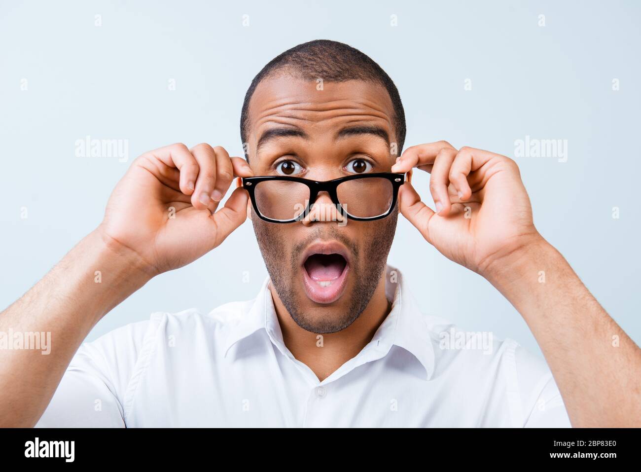 Have an idea! Young mulatto american student on pure background in ...