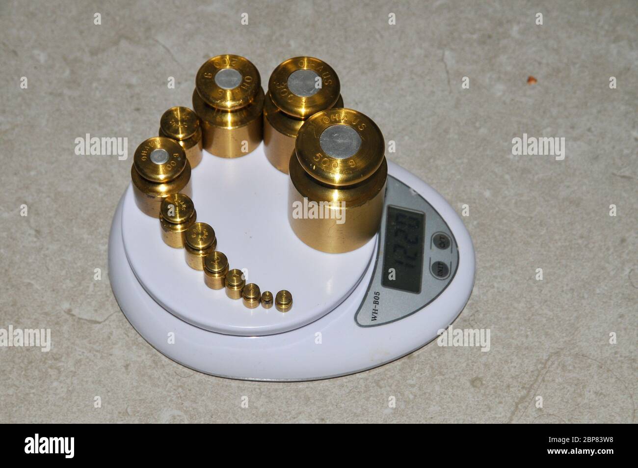 Precision weights of different value and a digital scale Stock Photo ...