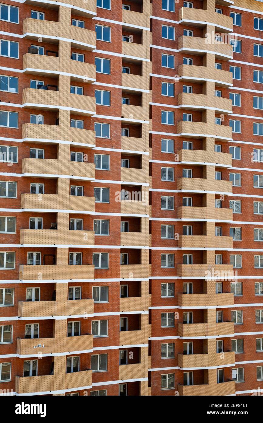 Unfinished high-rise apartment building. Close-up. City real estate ...