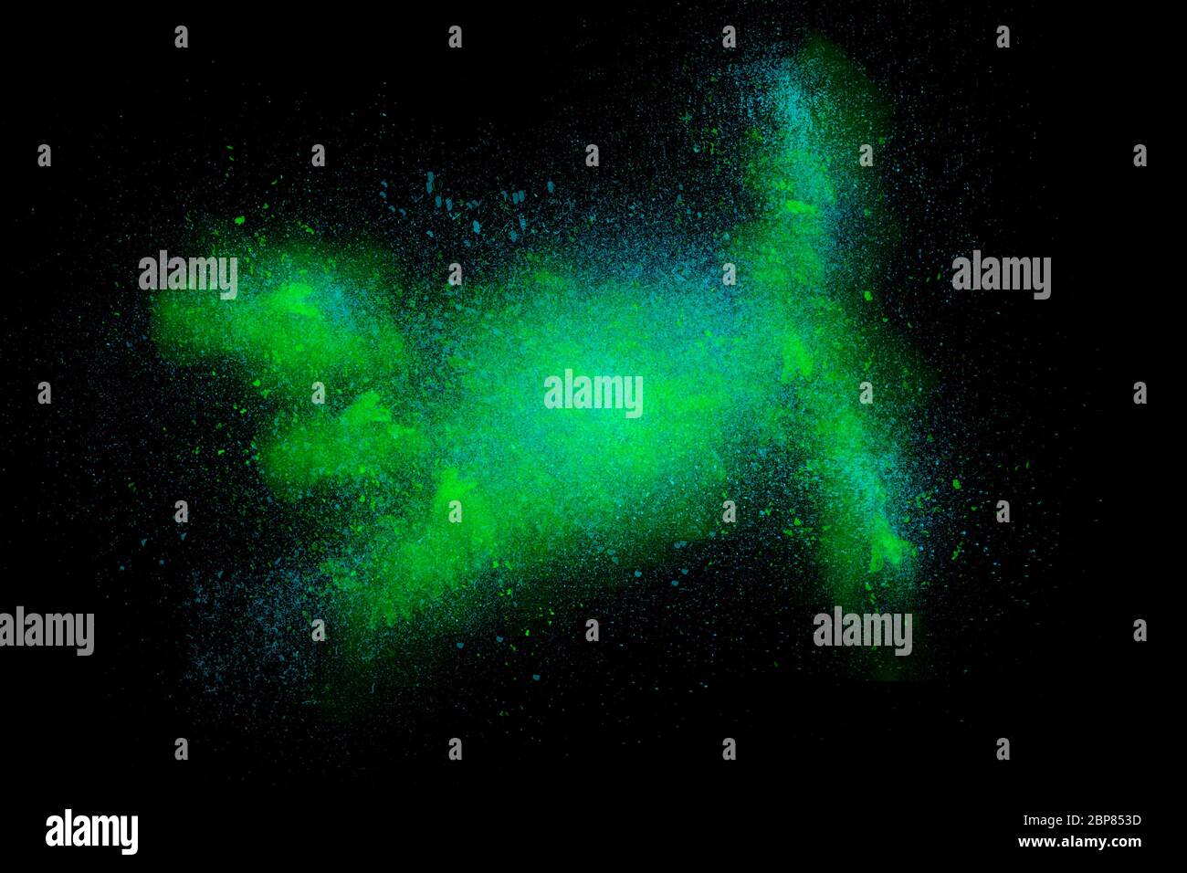 Freeze motion of colorful green blue powder paint exploding isolated on ...