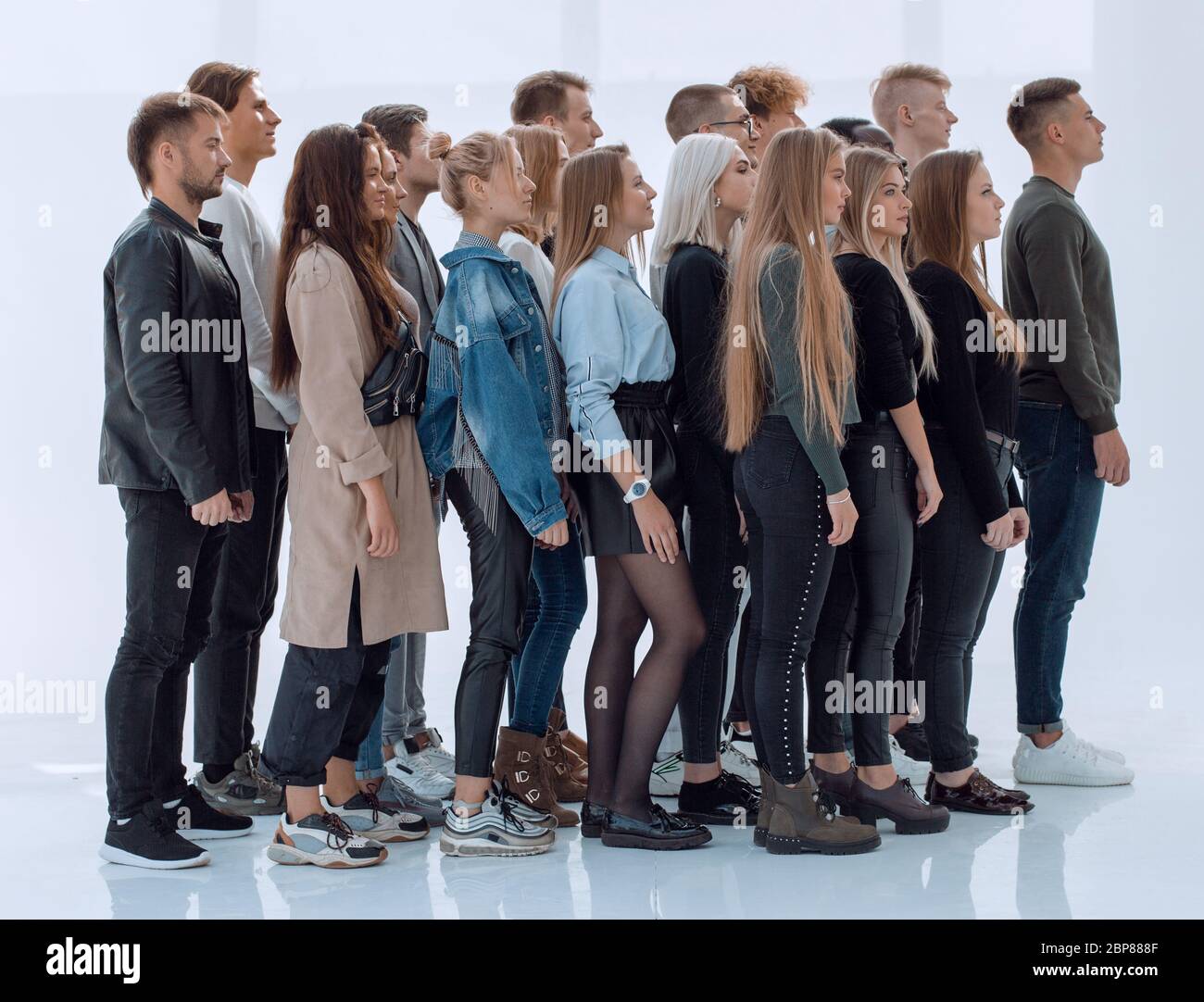 side view. an organized group of young people Stock Photo - Alamy