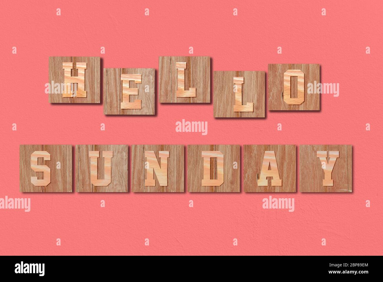 Hello Sunday; alphabet letters made from wooden on red background Stock ...