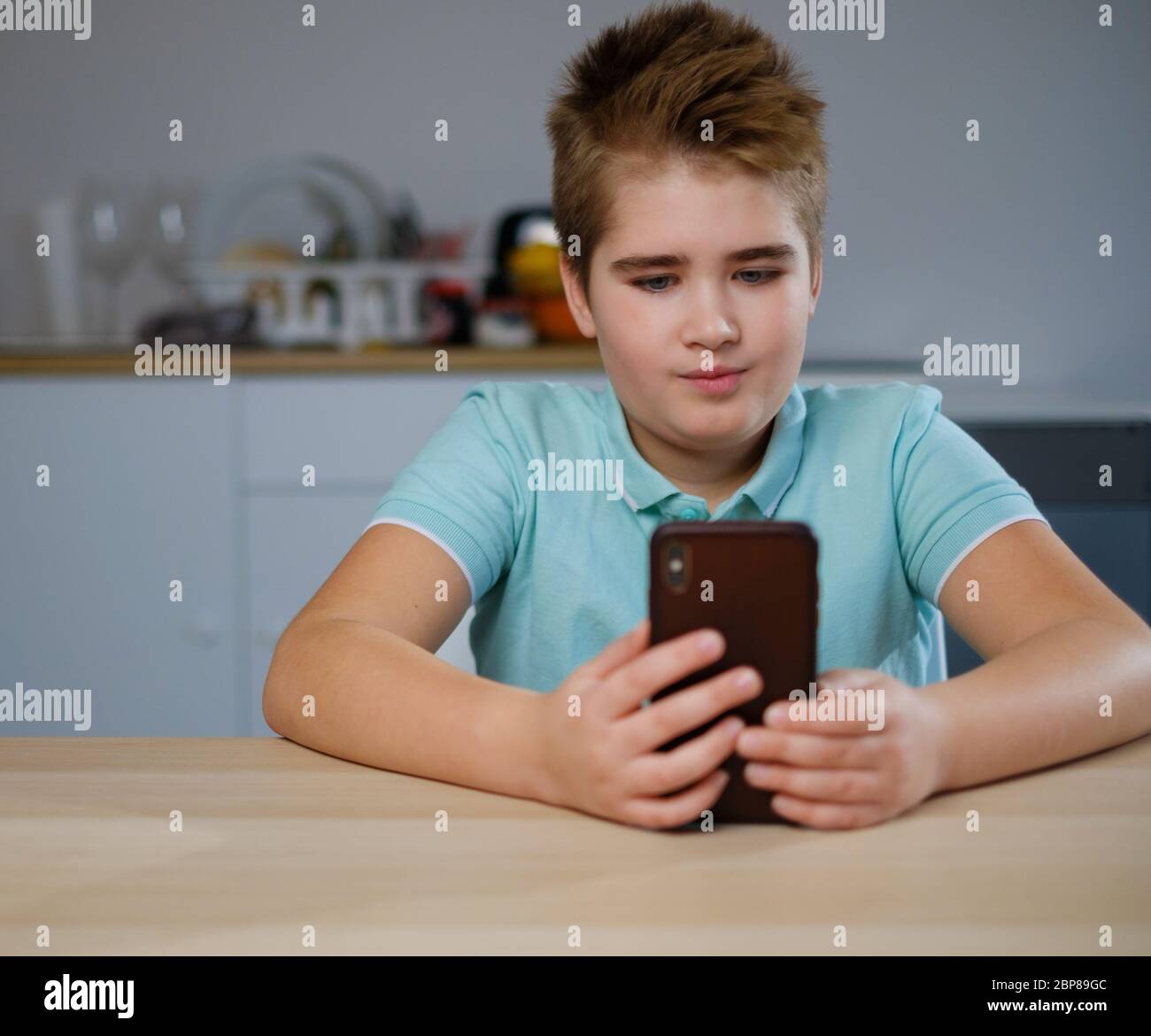 Happy boymaking a video call Stock Photo - Alamy