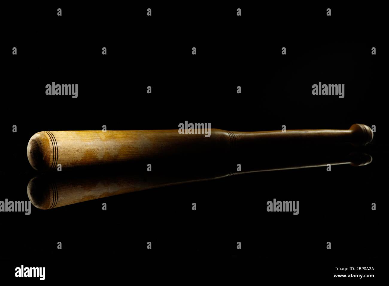 Baseball bat. Professional sport equipment isolated on black studio ...