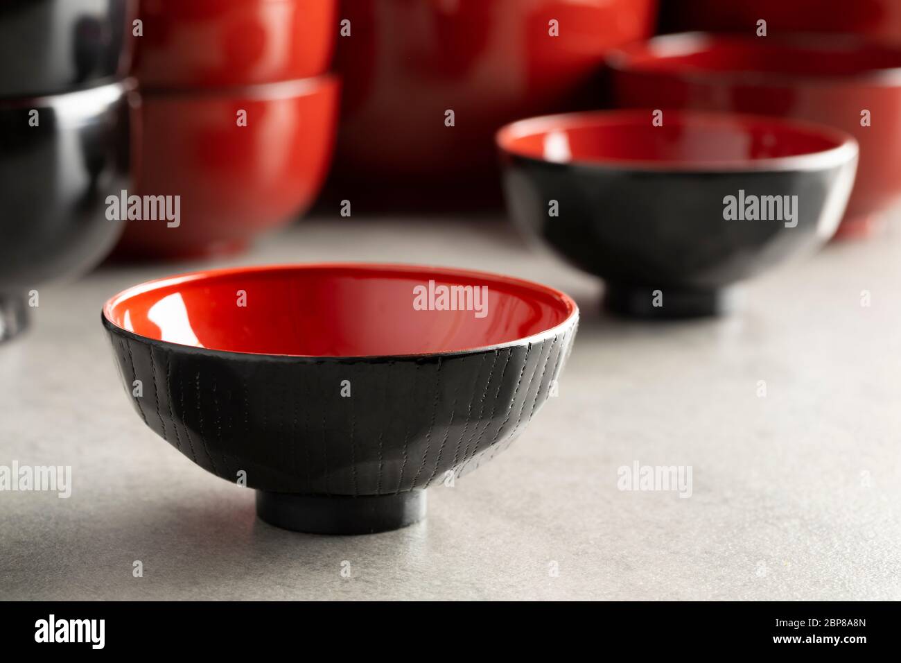 Collection of red and black traditional Japanese bowls Stock Photo - Alamy