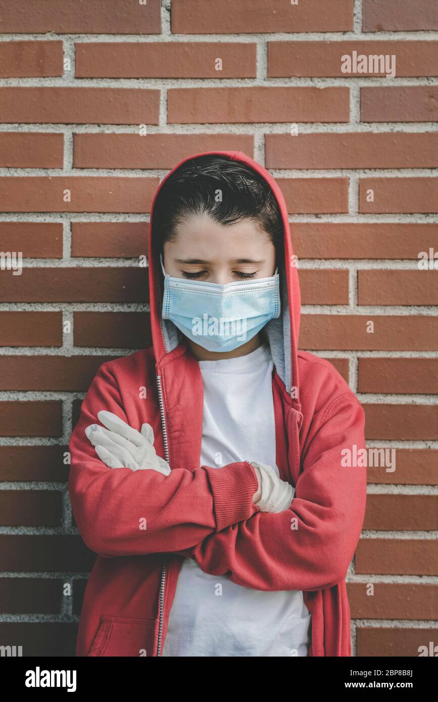 Sad kid medical mask hi-res stock photography and images - Alamy