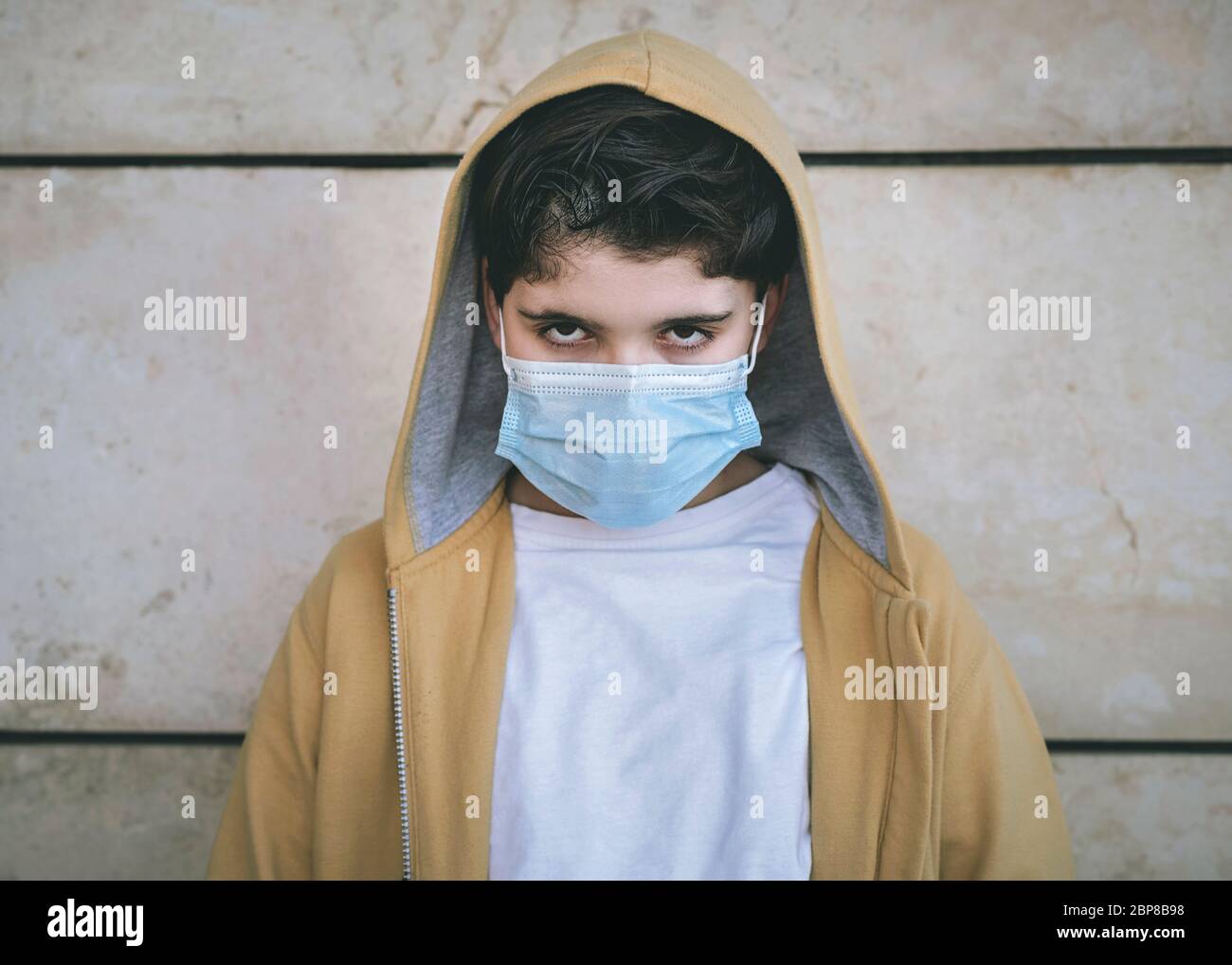 Coronavirus,angry boy wearing medical mask outdoor Stock Photo - Alamy