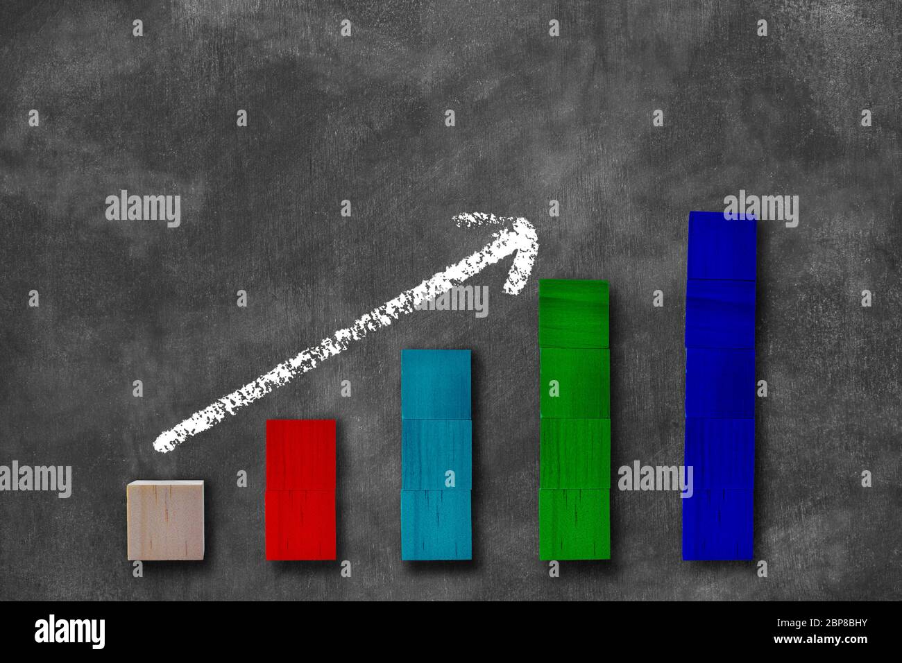 Chart of colored wooden. graph of economics growth on chalkboard ...