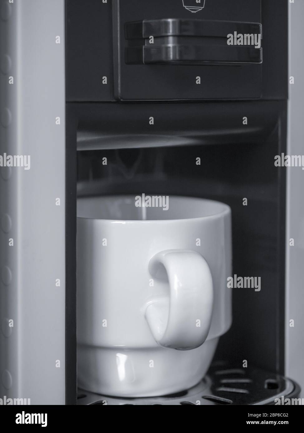 White ceramic coffee cup on coffee machine, vertical style Stock Photo ...