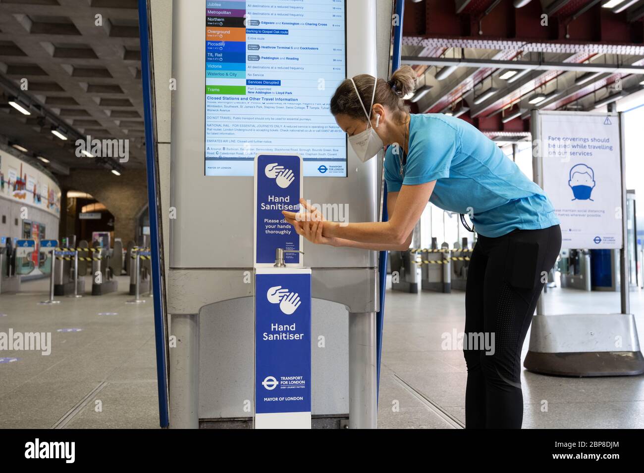 Commuters using hand sanitiser points at Waterloo Underground station ...
