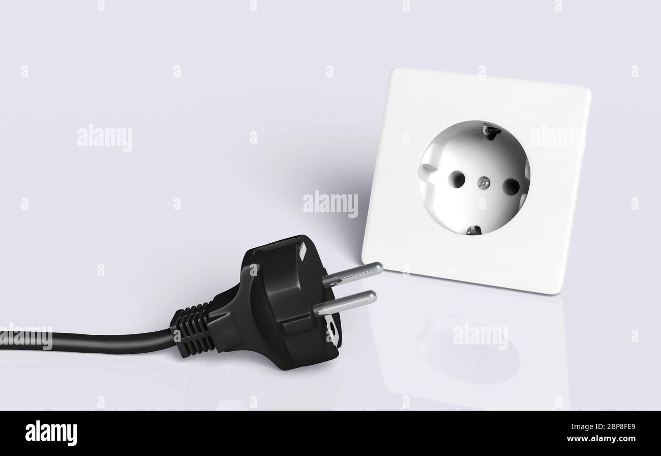 european disconnected black plug lies on the ground in front of a white ...