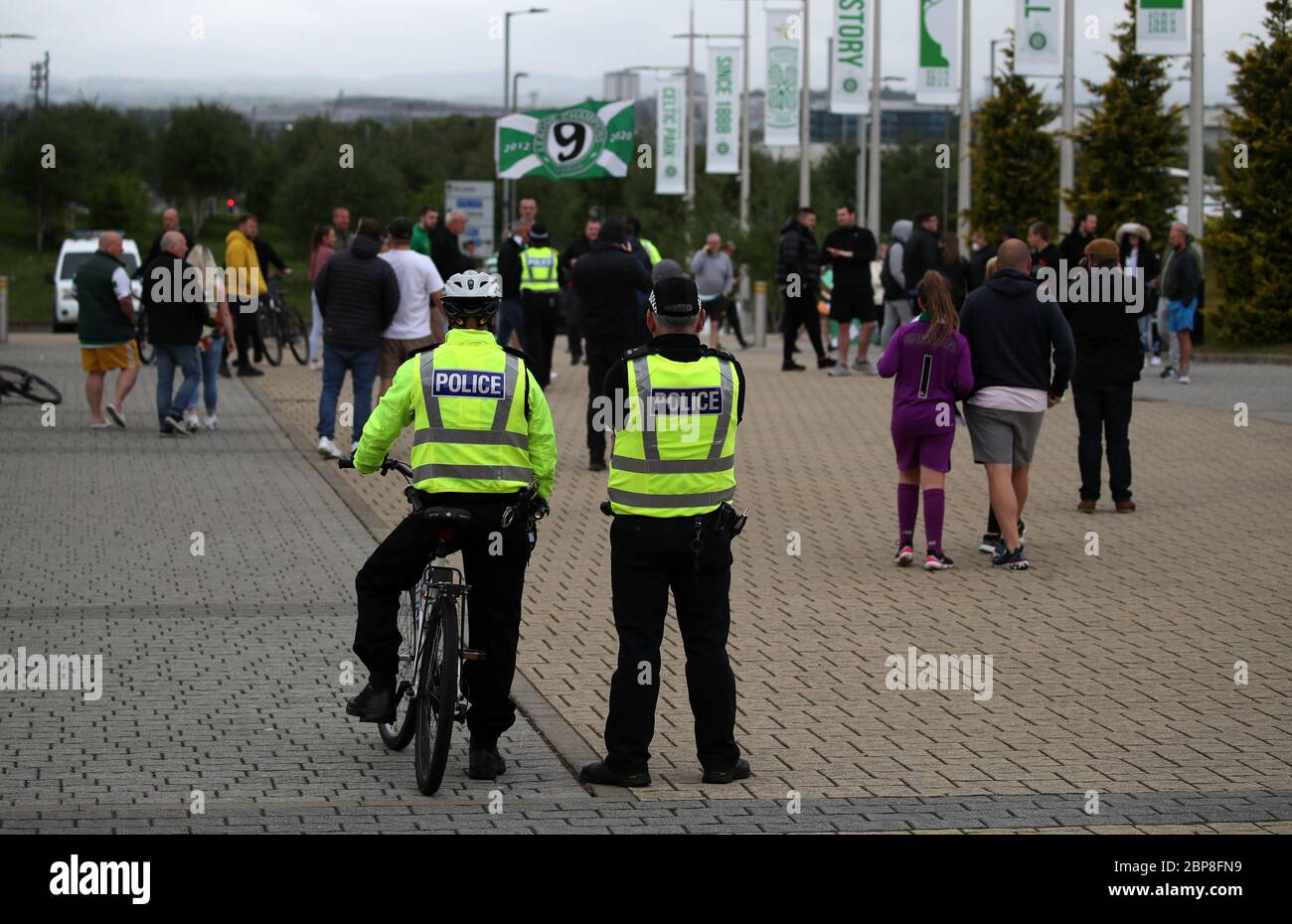 Police monitor Celtic fans as they gather outside Celtic Park after ...
